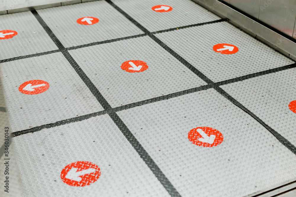 View of footprint sign for stand in lift. Social distancing with COVID ...