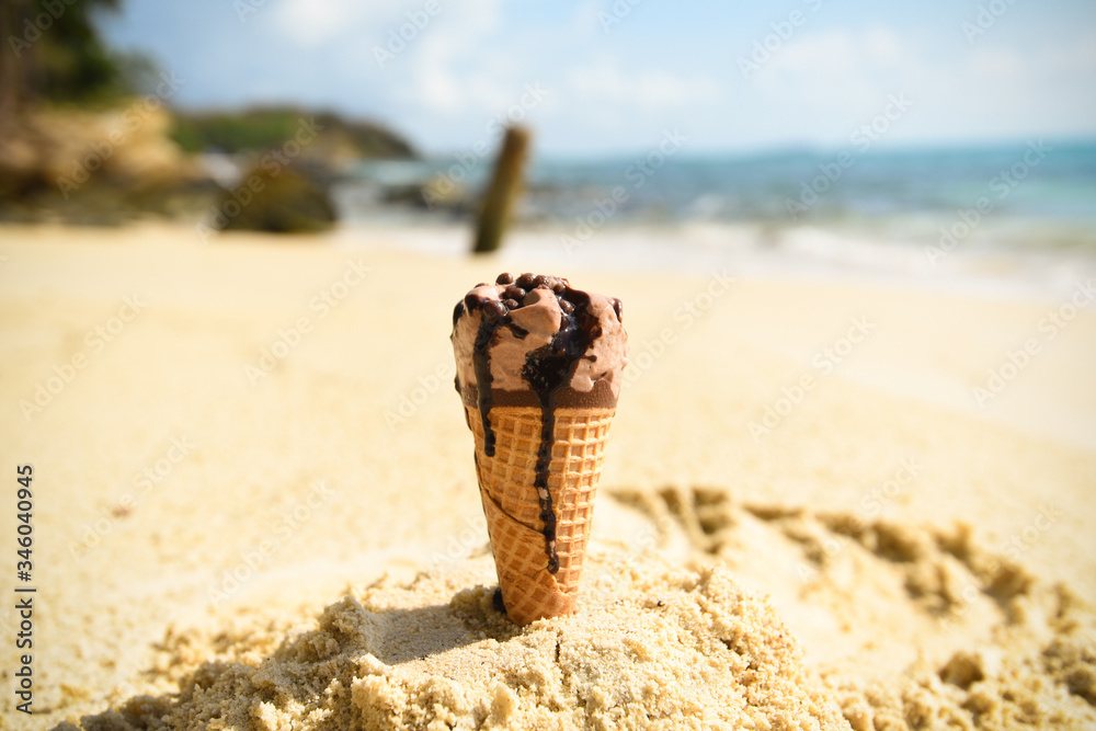 Ice cream cone on sand beach background - Melting ice cream on beach ...
