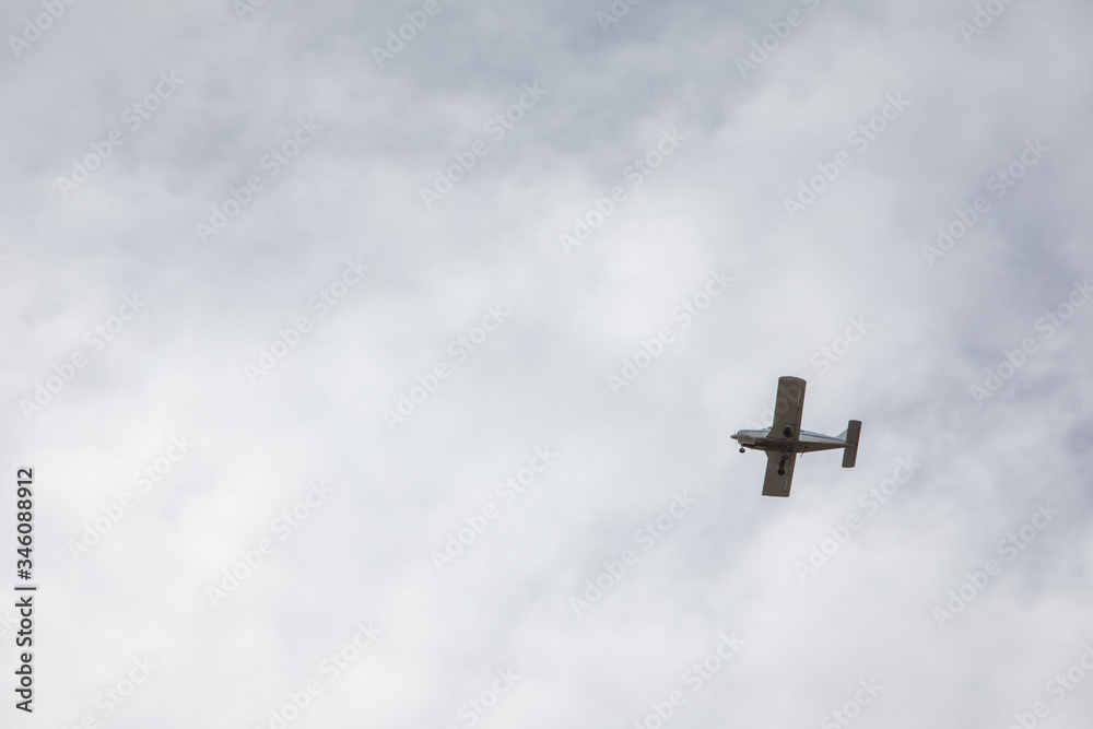 small airplane in sky Stock Photo | Adobe Stock