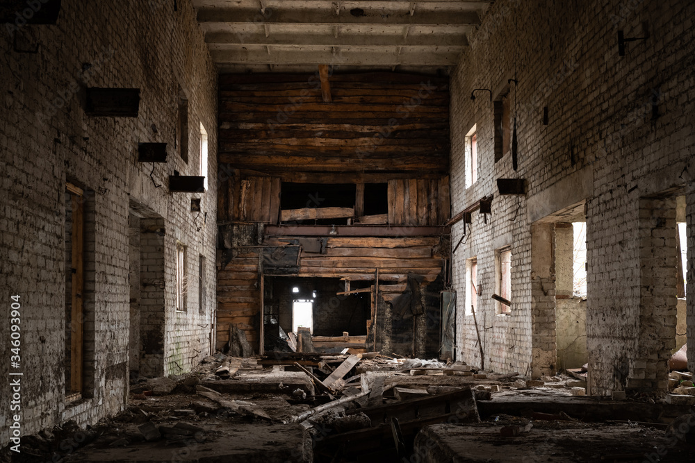 Interior of the old ruined abandoned barn for cows. Destroyed ...