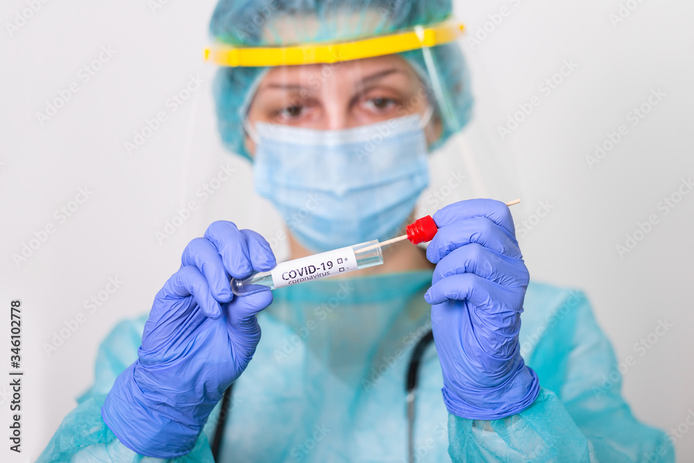 Lab technician holding swab collection kit,Coronavirus COVID-19 ...