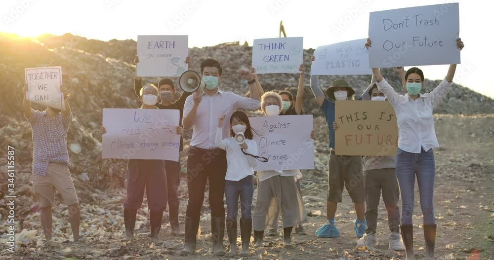 Group of mixed ages asian protestors making a protest about global ...