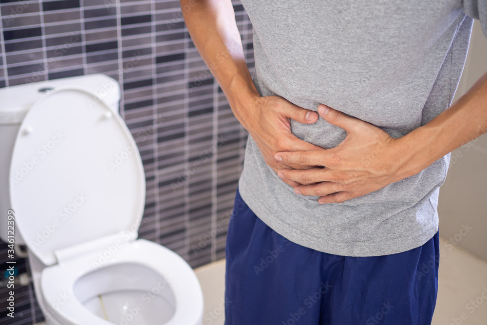 Men have stomachache and use their hands to hold their stomach In the ...