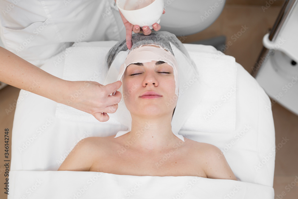 Face peeling mask, spa beauty treatment, skincare. Woman getting facial ...