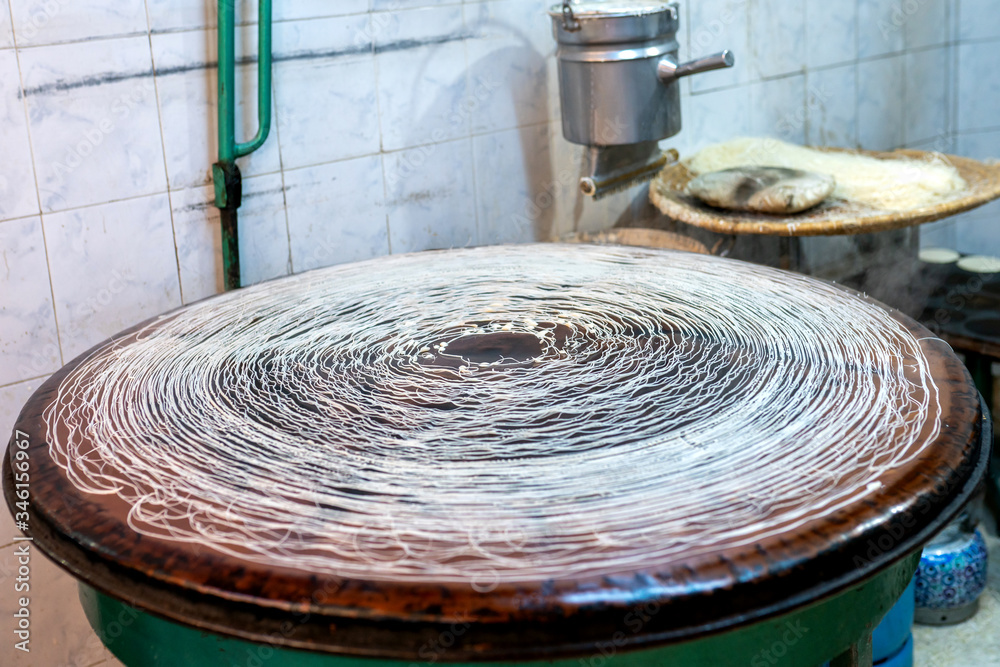 The production stages of the Antioch Kunefe dessert material, cooking ...