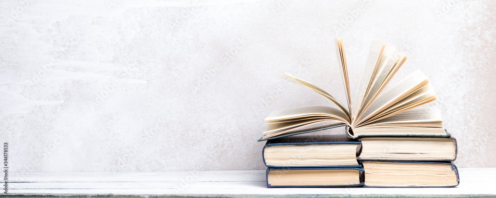 Composition with vintage old hardback books, diary, fanned pages on ...