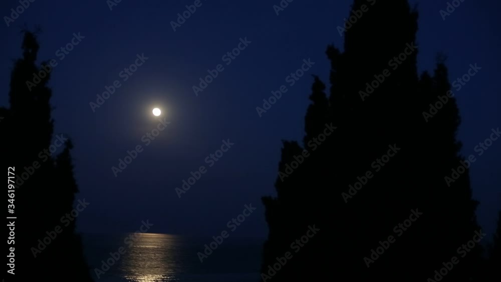 Beautiful full moon on a cloudless sky above the sea with a inspiring ...