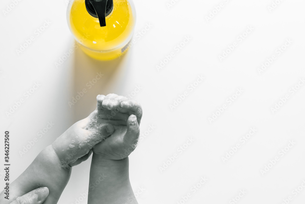 baby child washing hands with antibacterial liquid soap dispenser ...