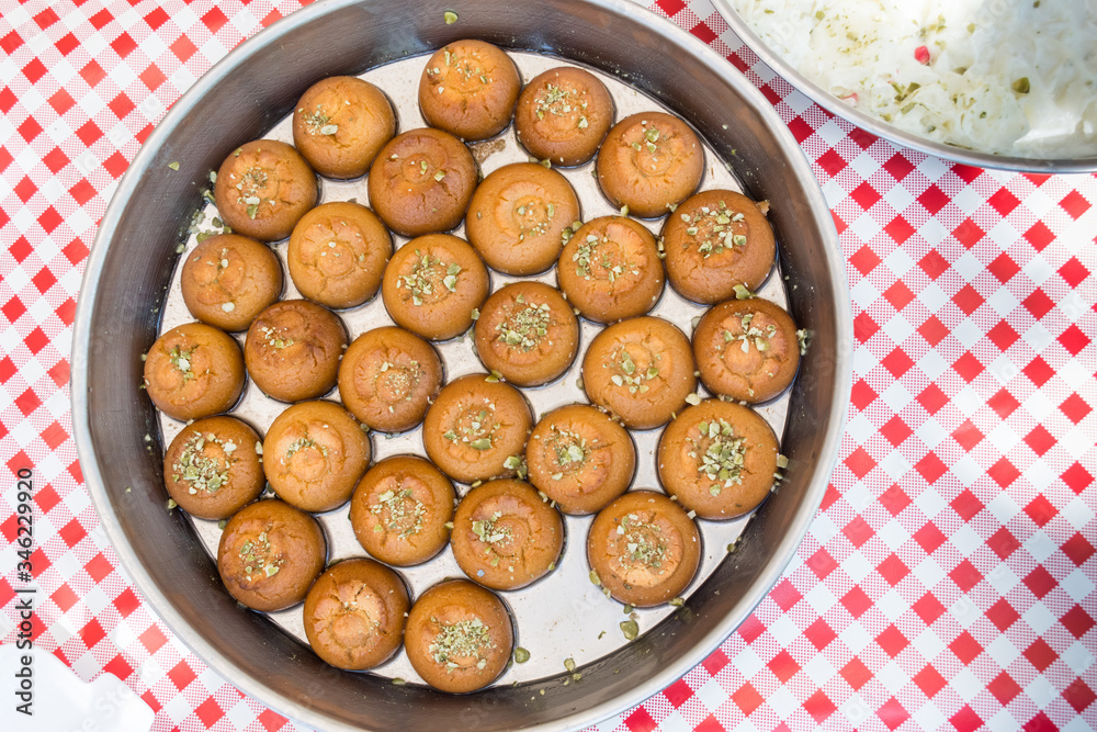 Lokma, Turkish street food dessert. Bites flavoured with honey, sugar ...