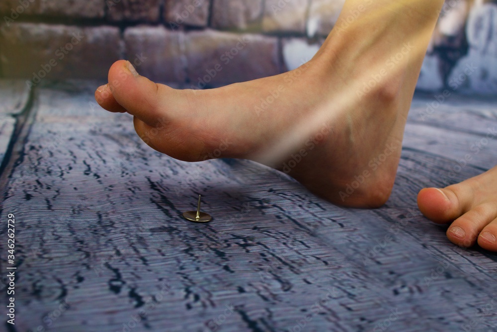 Be careful where you step! Foot and sharp tack. Watch your next steps ...