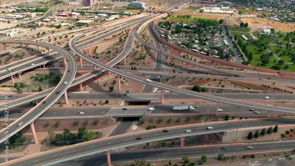 Aerial: Traffic on a busy freeway interchange of Interstate 25 ...