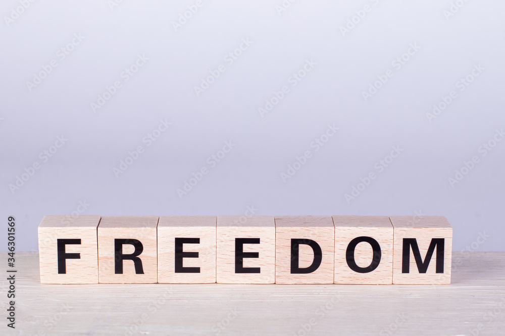 wooden cubes building the word Freedom, white background Stock Photo ...