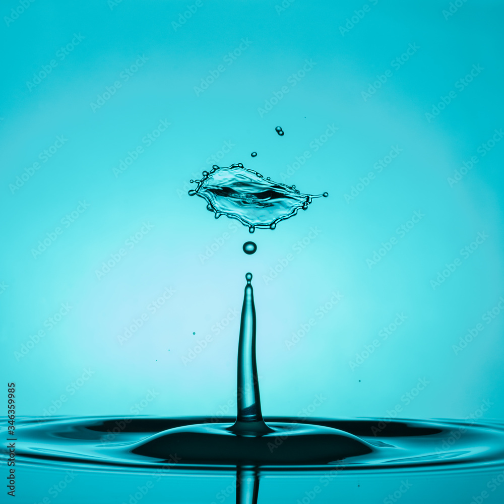 Water Drop Collisions Macro Photography with blue background Stock ...