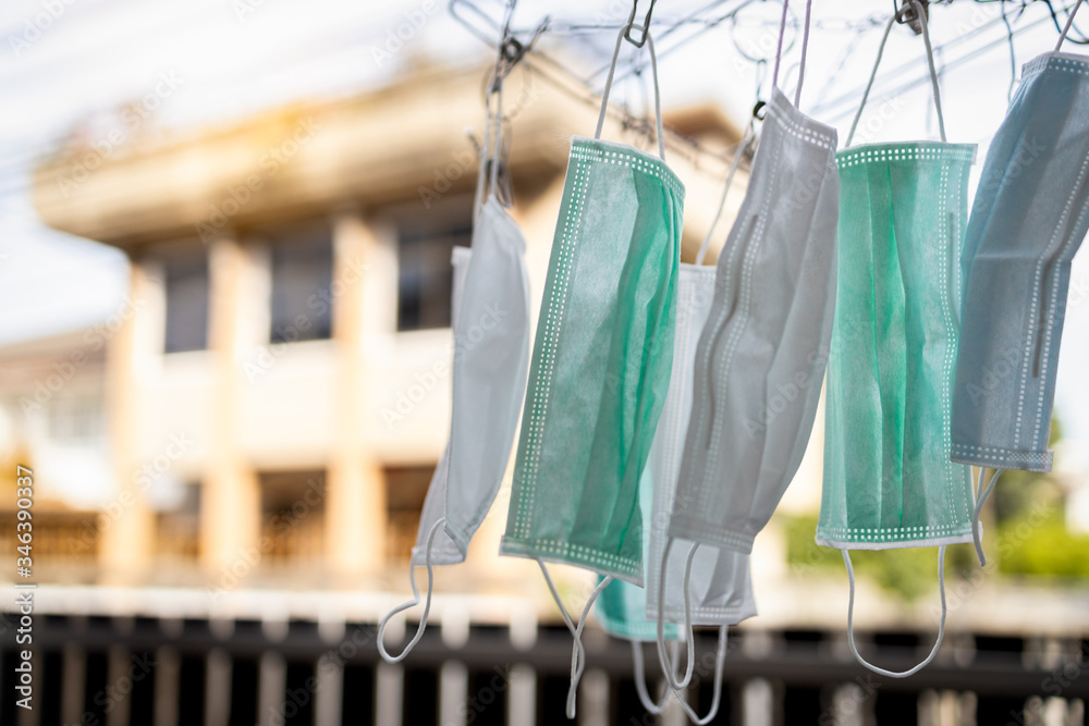 Medical masks hanging dry on round clothes hanger,washing for reuse ...