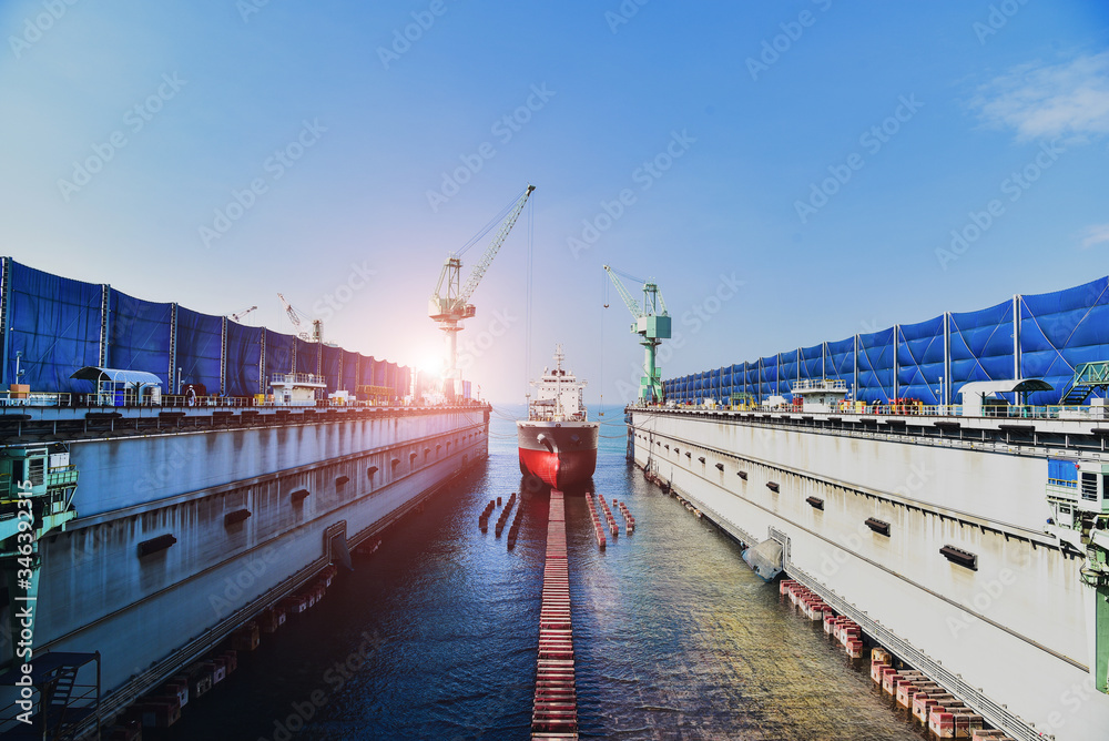 Dry dock with Cargo Ship maintennance or repair at floating dock in ...