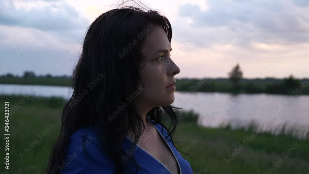 Sad Woman Stands Thinking Looking on Sunset Above River and Forest ...
