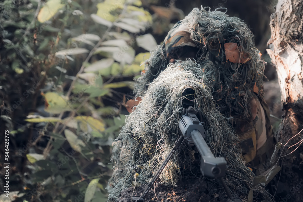 soldier with a rifle.Army soldier in protective uniform holding rifle ...