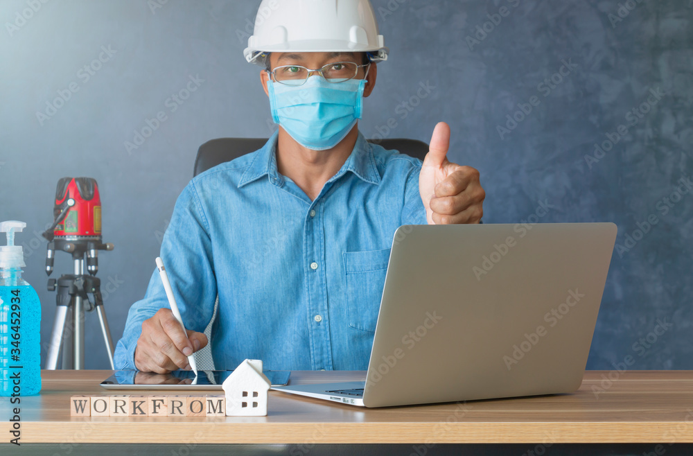 Man engineer wearing safety mask giving the thumbs up hand signal of ...