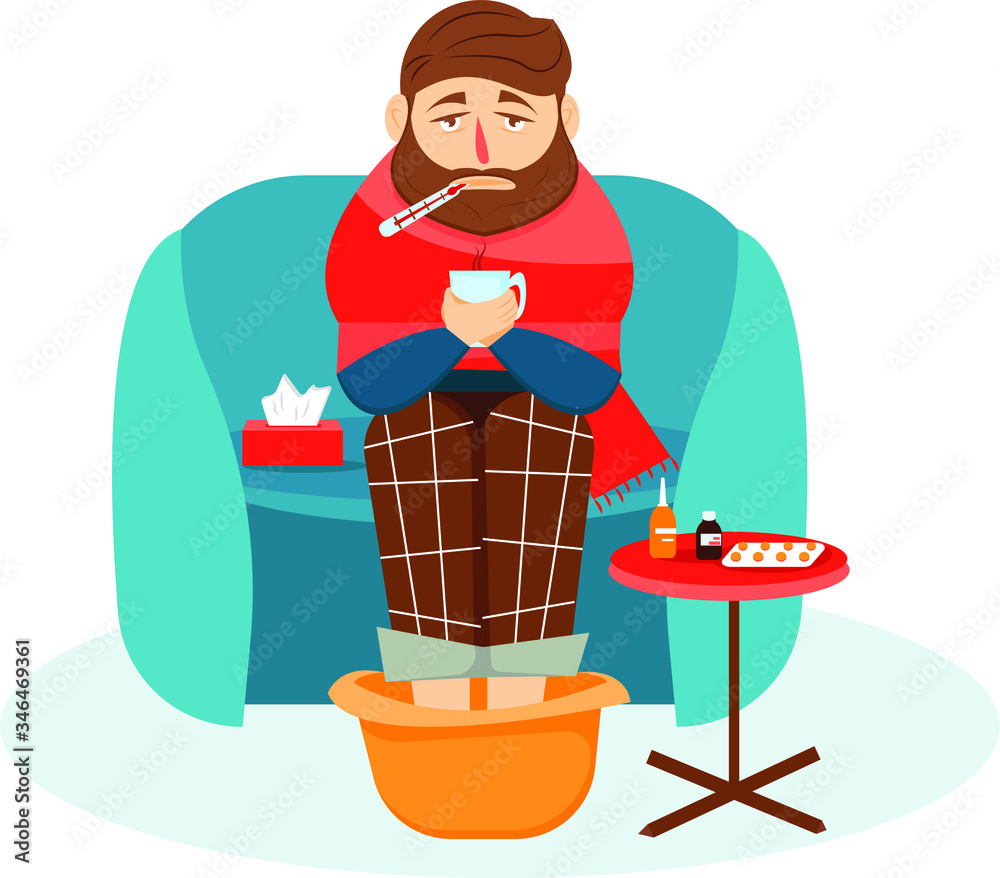 Sick male with flu and cold symptoms. Man sits in a chair with a cup of ...