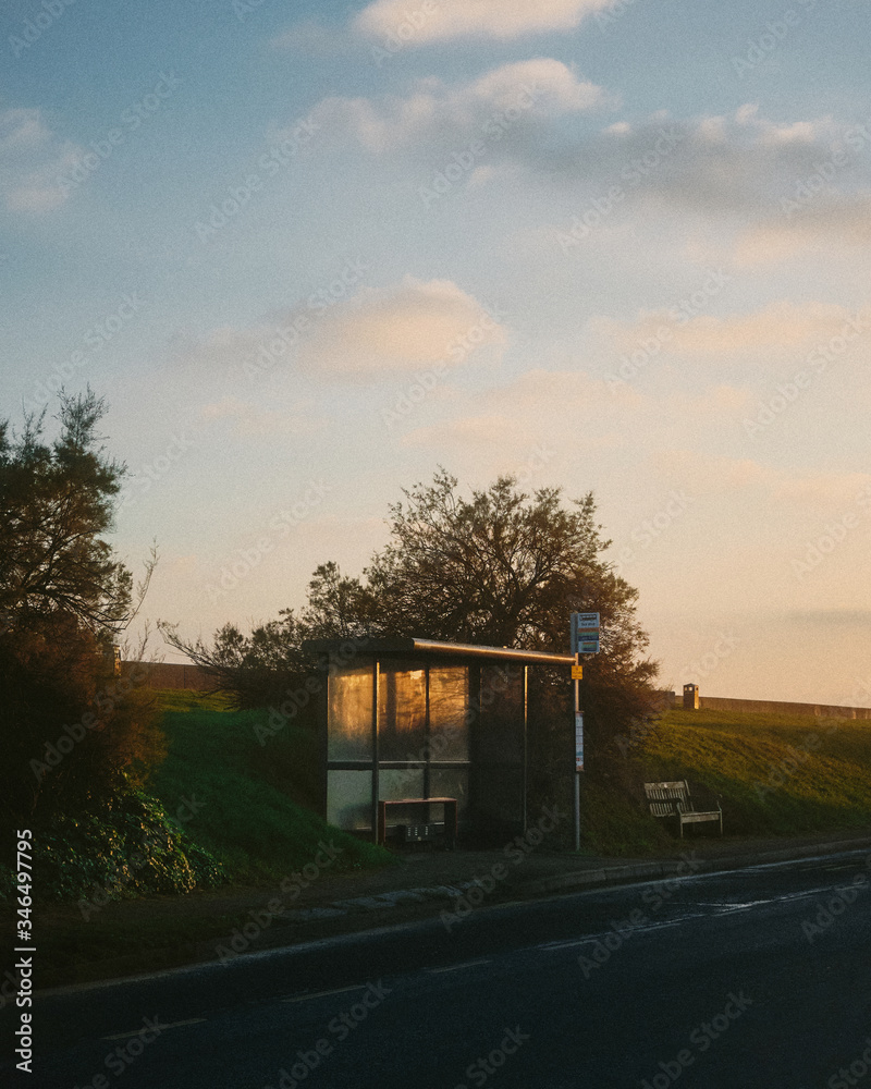 Bus stop at sunset Stock Photo | Adobe Stock