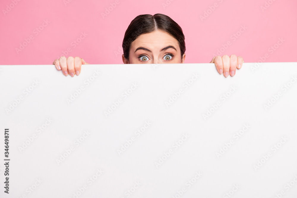 Photo of cheerful pretty lady holding hands big empty white paper ...