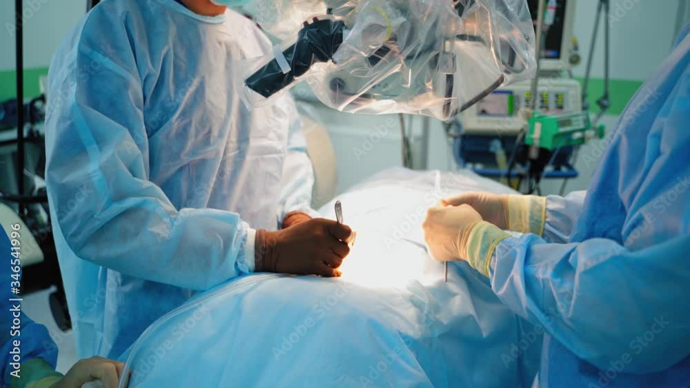 Doctor performing surgery. Close up of surgeon during surgery with ...