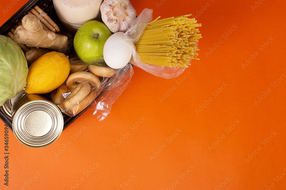 food on an orange background view from above Stock Photo | Adobe Stock