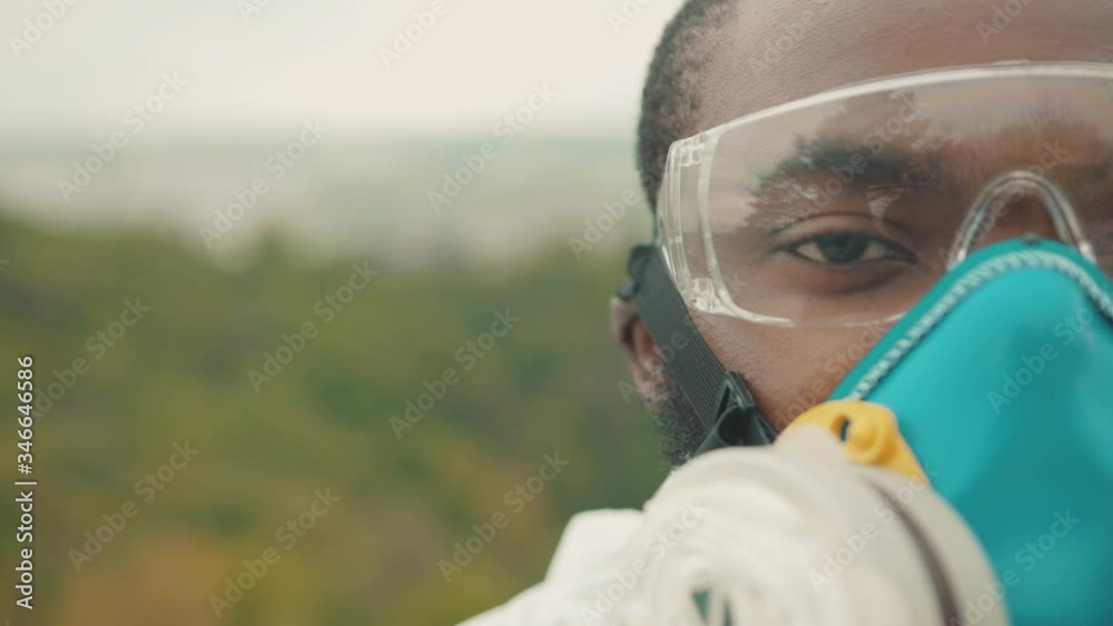 Pandemic. Half-face portrait african american guy scientist wearing ...