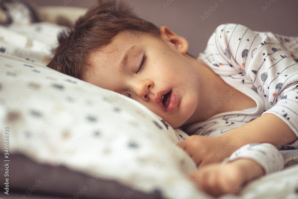 Photo of baby boy sleeping. His favorite napping spot. Adorable kid boy ...