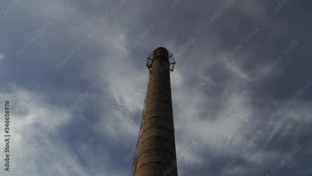 A majestic, old-fashioned big tower from bricks - a view from a bottom ...
