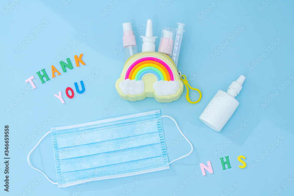 The text "thank you", a blue background, protective masks and sprays ...
