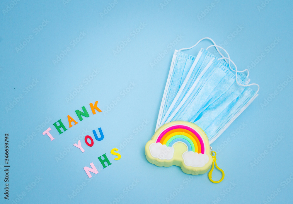 The text "thank you", a blue background, protective masks and sprays ...