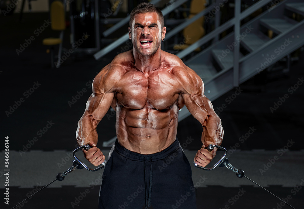 Body Builder Workout at the Gym. Performing Cross Over Exercise for ...