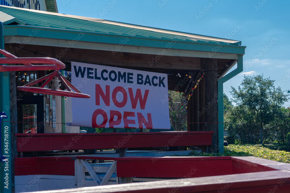 Welcome back now open sign on a patio Stock Photo | Adobe Stock