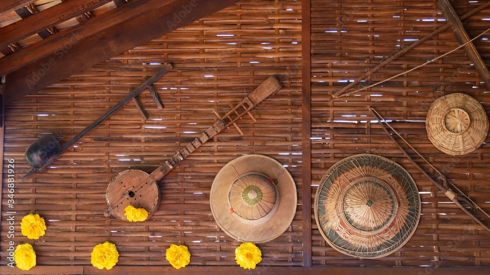 Thai instrument and rattan hat on bamboo wall, Thai traditional ...