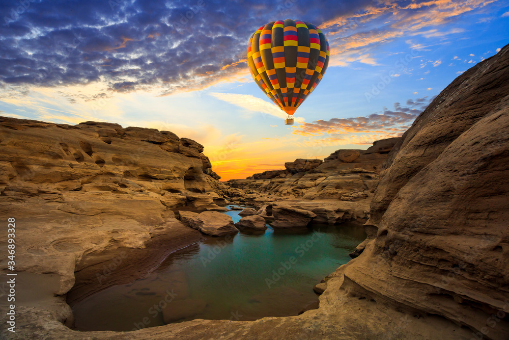 Hot air balloon over the sea at amazing sunset - Long exposure image of ...