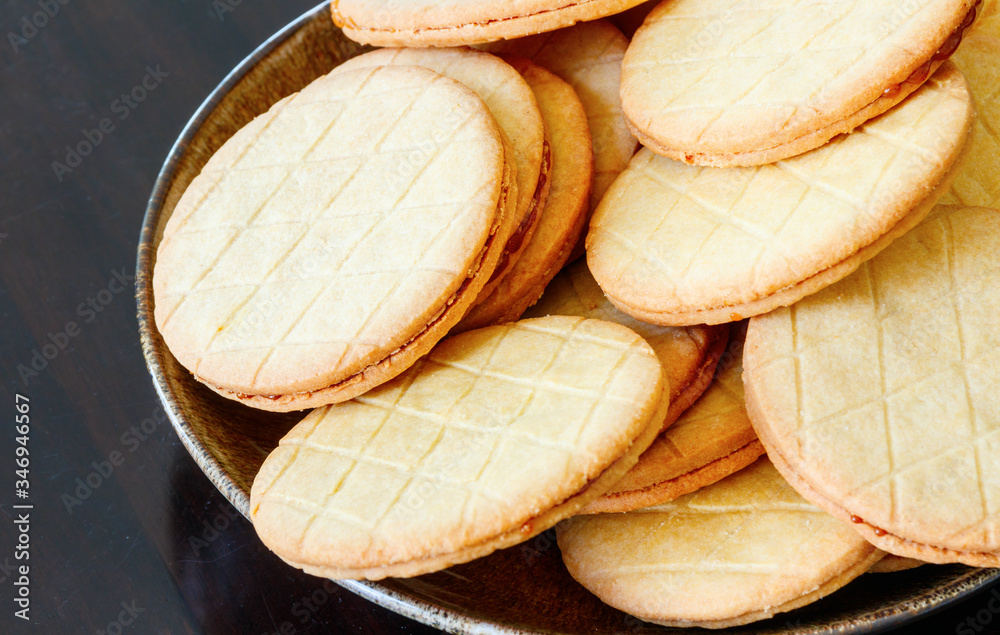 Dish with typical dutch syrup cookies (stroopkoeken) a variant of the ...