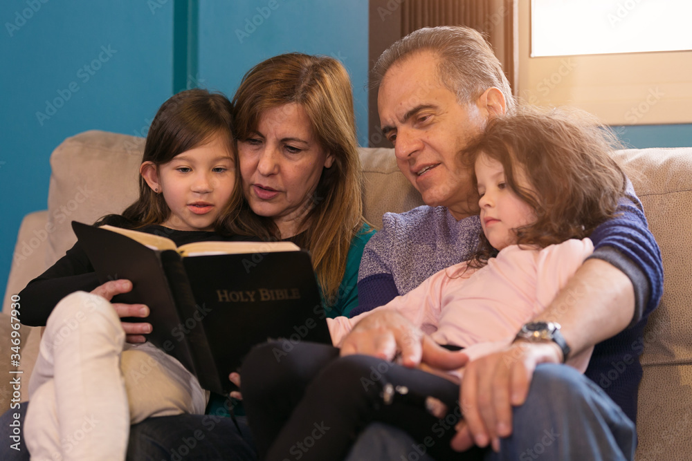 Family Reading the Bible together Stock Photo | Adobe Stock