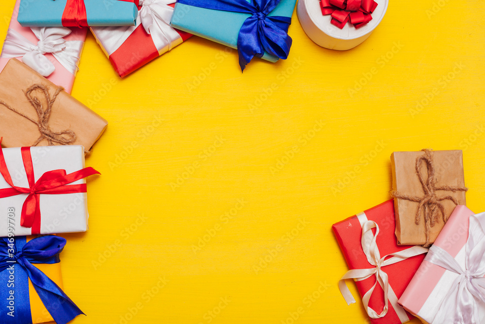 Multi-colored gifts on the birthday party background for inscriptions ...