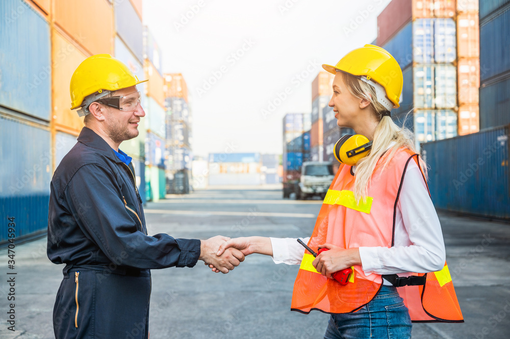 Happy dealing shaking hands two foreman man & woman worker working ...