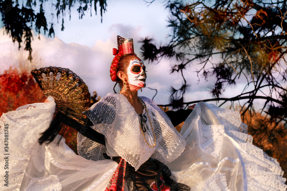 Woman with the painted face of La Catrina dances La Sandunga on the Day ...