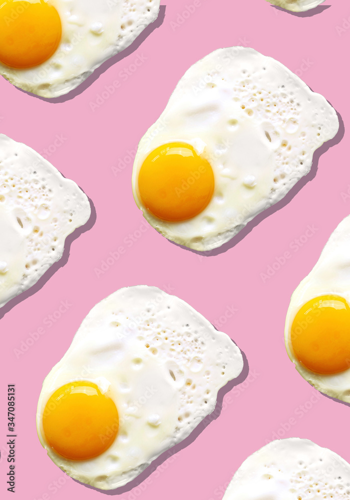 Fried egg or scrambled eggs pattern on pink background. Creative food ...