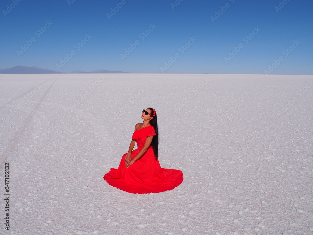 Girl model with long black hair in the red long dress, Uyuni Salt Flat ...