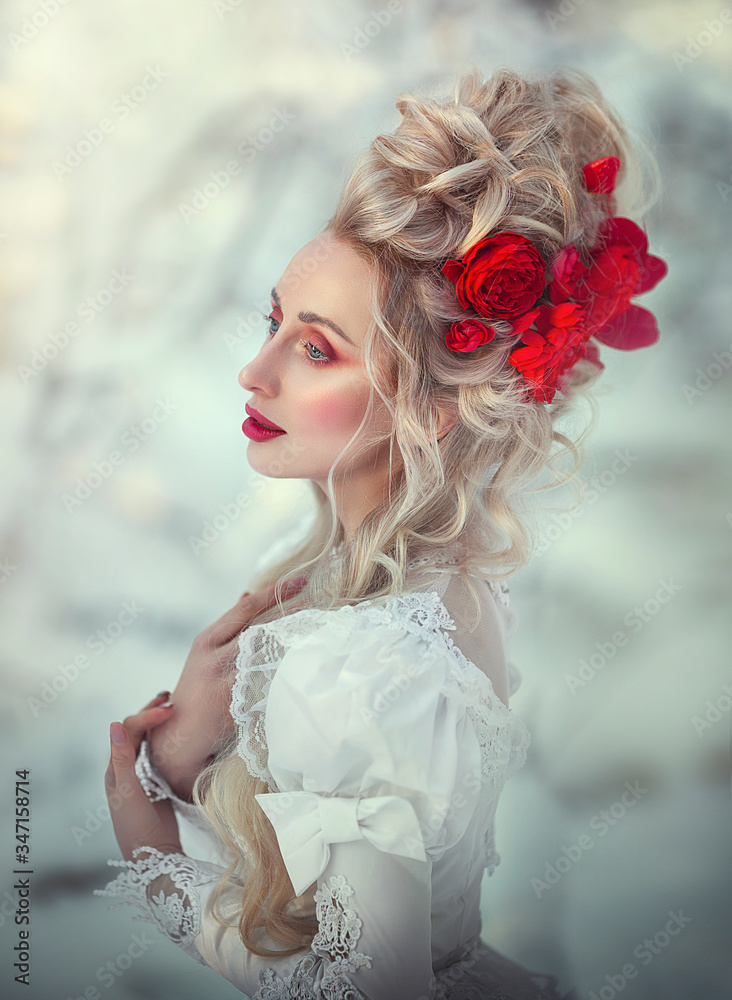 Portrait of an old-fashioned blonde woman with a medieval hairstyle of ...