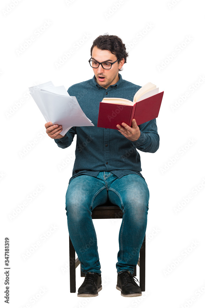 Full length of perplexed student looking stunned at paper projects and ...