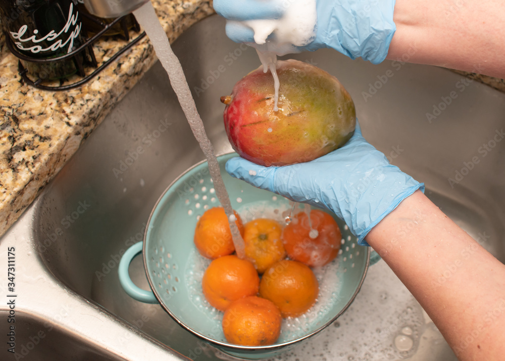 Washing fruit cleaning and scrubbing Stock Photo | Adobe Stock
