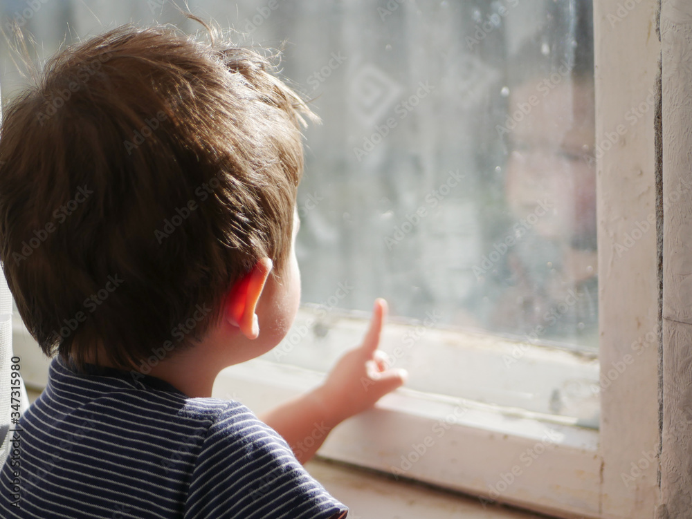 child shows the window with a finger Stock Photo | Adobe Stock