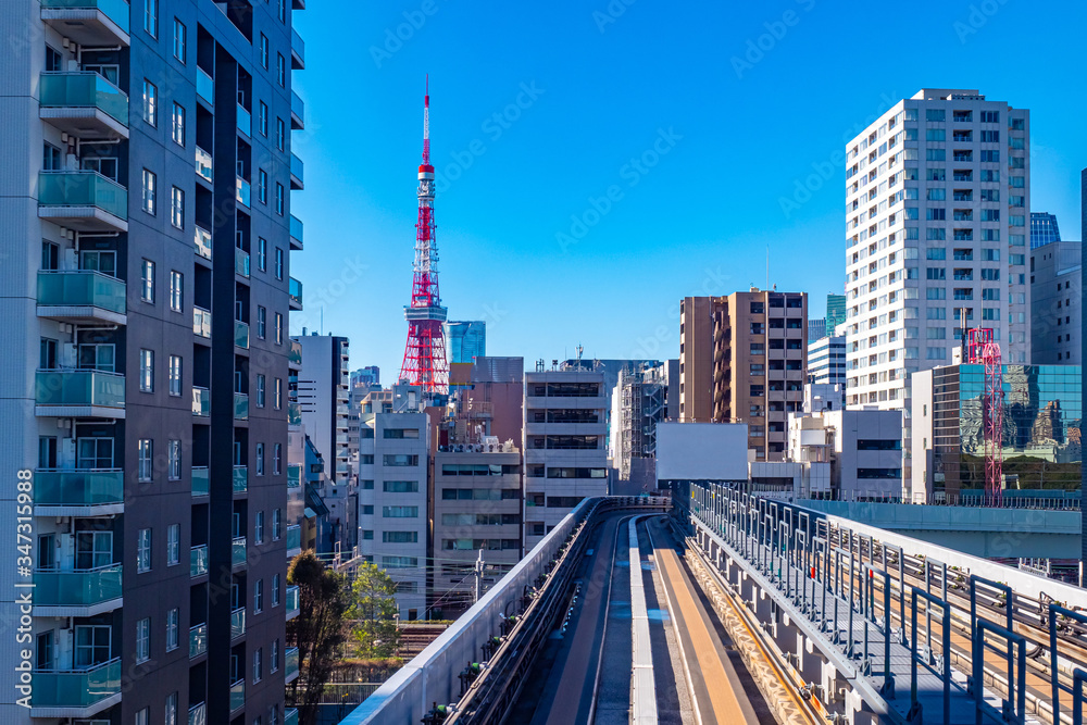 Japan. A trestle near skyscrapers in Tokyo. Railroad rack with rails in ...