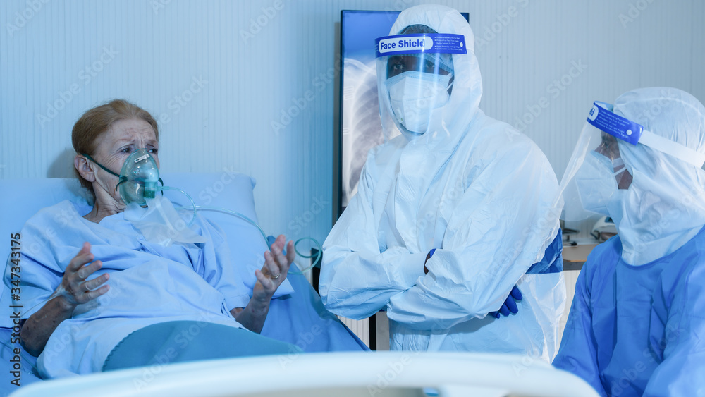 coronavirus covid-19 infected caucasian senior patient under doctor and ...