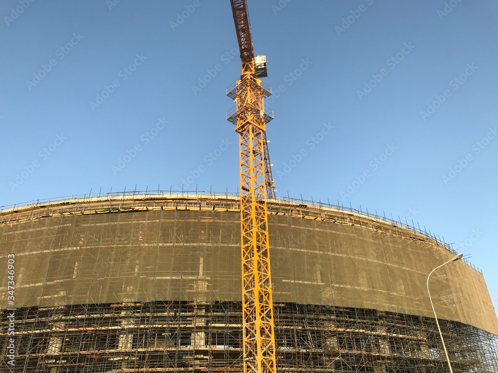 Project Site Construction under progress using tower crane and ...